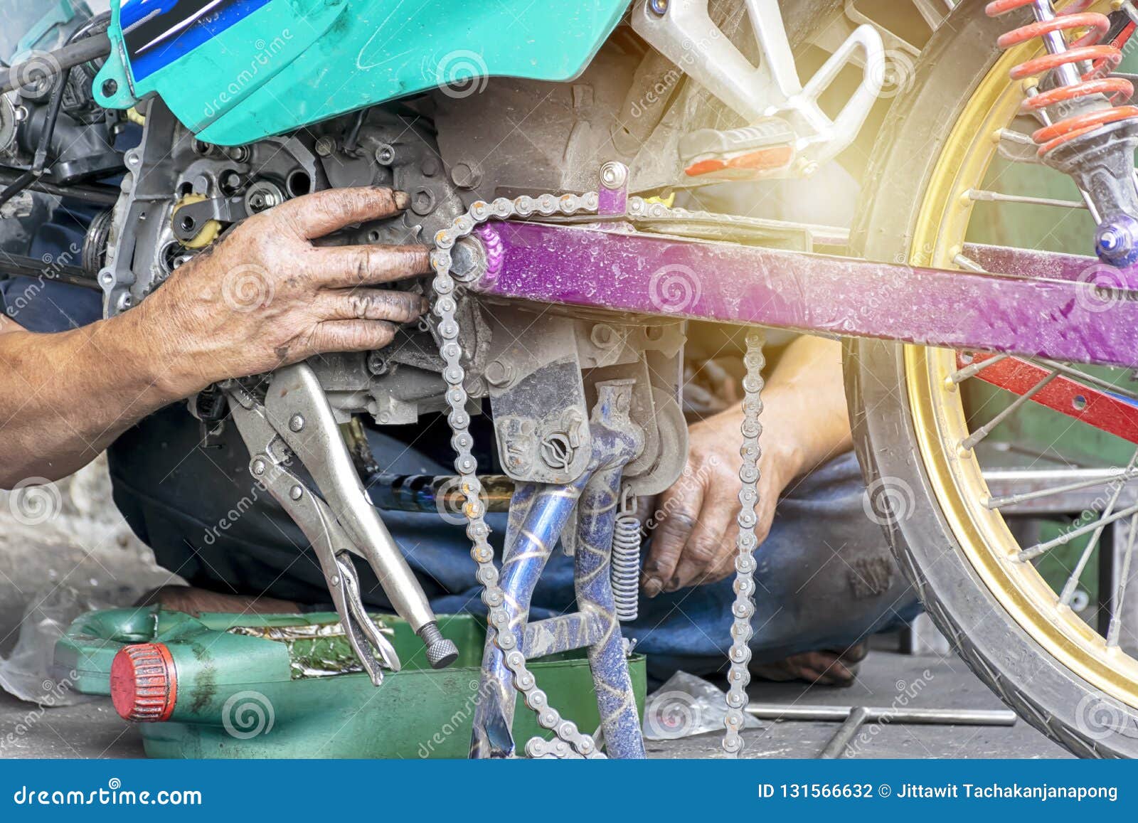 Motorcycle Engine Repair Workers are Working Hard. Stock Photo - Image ...