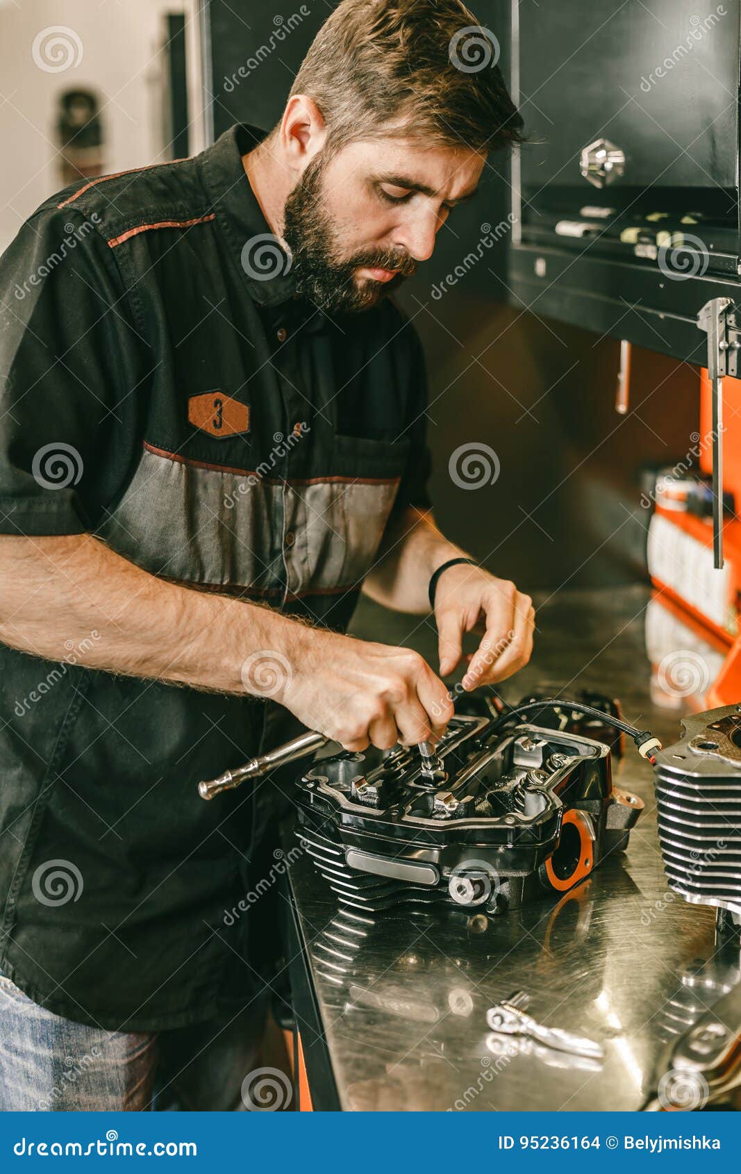 Motorcycle Mechanic Engine Repair at Service Station Stock Photo ...