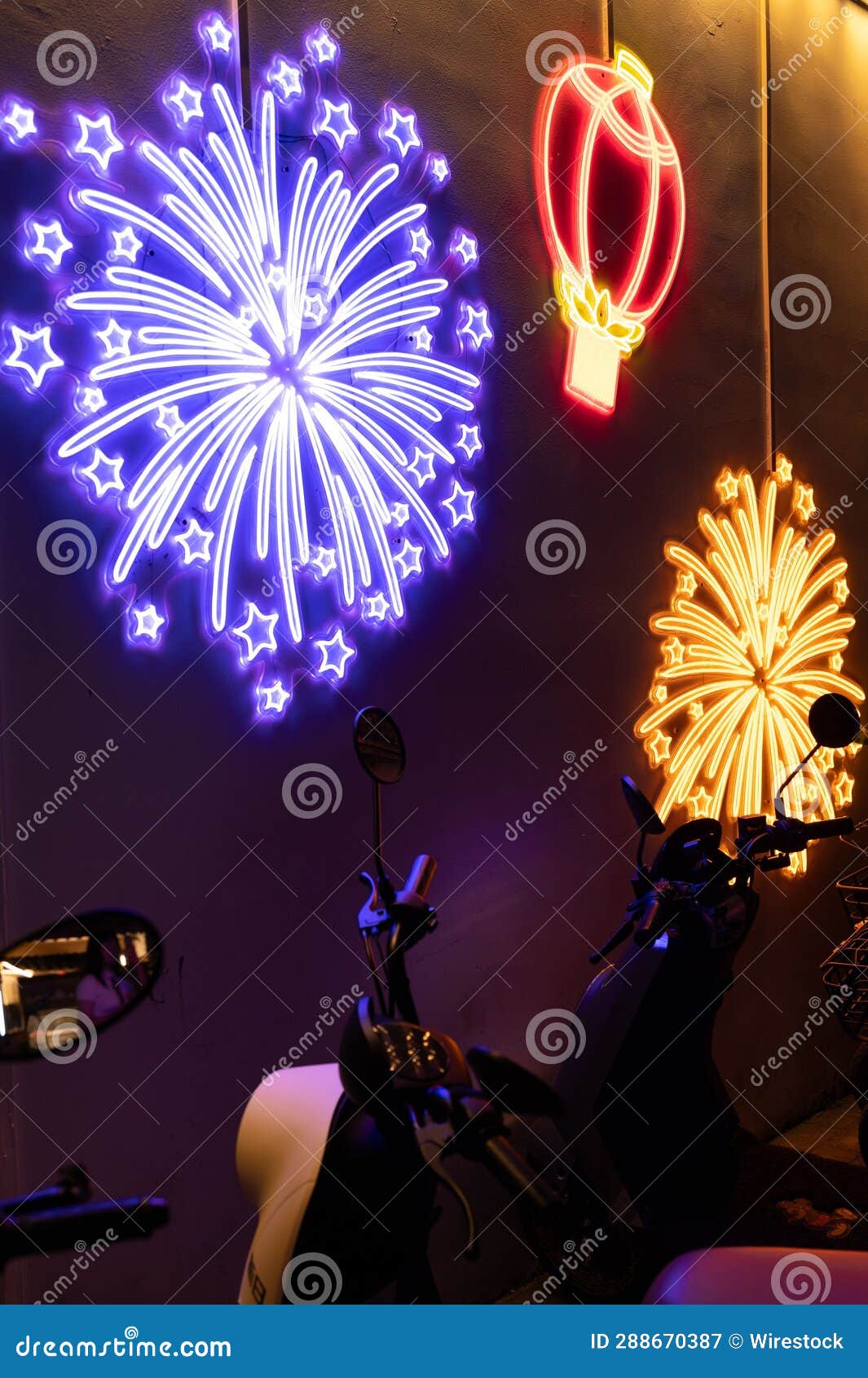 A Motorcycle that is Parked Next To a Building with Fireworks Stock ...