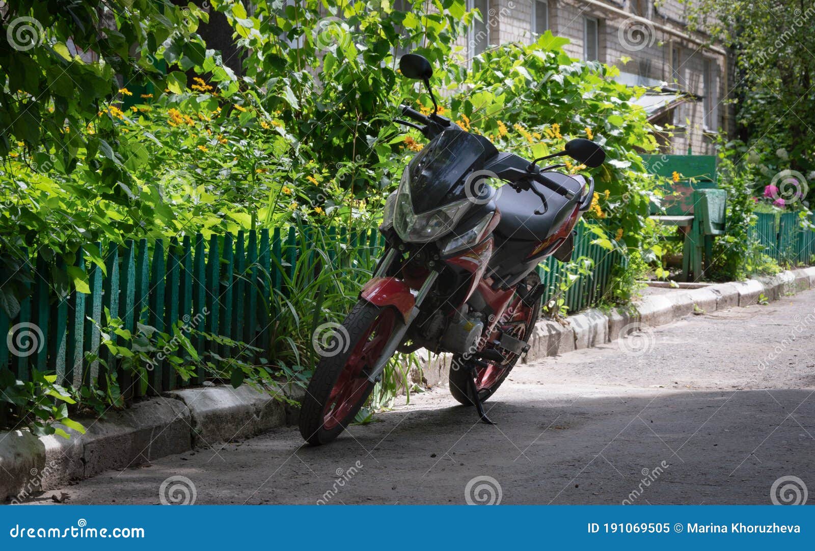Motorcycle Parked Near the Front Garden of the House. Stock Image ...