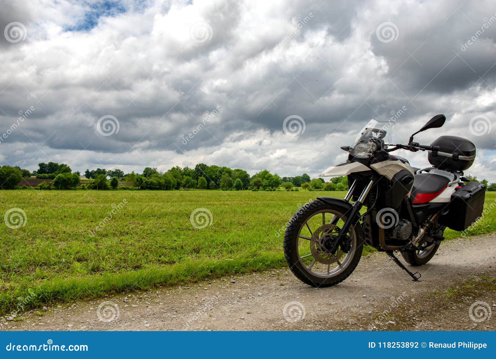 Motorcycle on a Path with a Cloudy Sky Stock Photo - Image of enduro ...