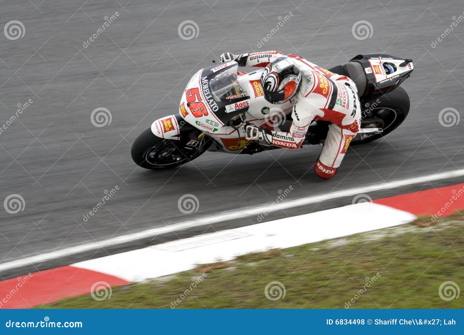 Motorcycle racer in action editorial stock photo. Image of polini - 6834498