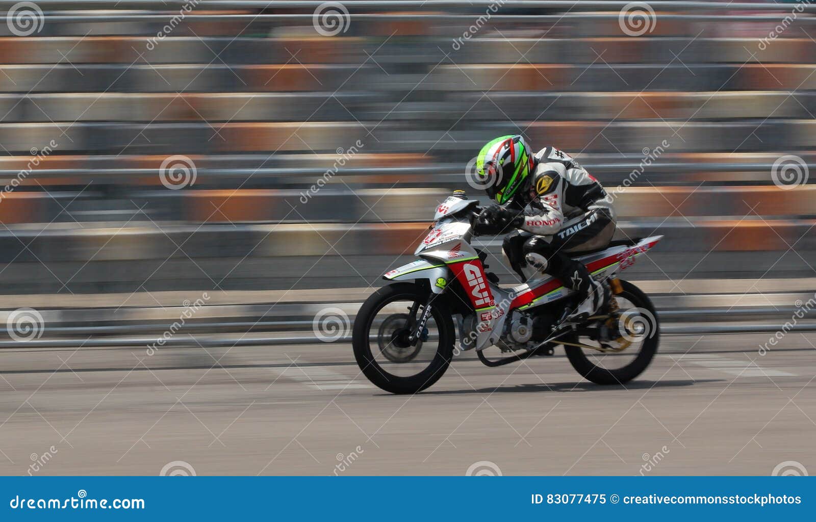 Motorcycle Racer On Silver Motorcycle Picture. Image: 83077475