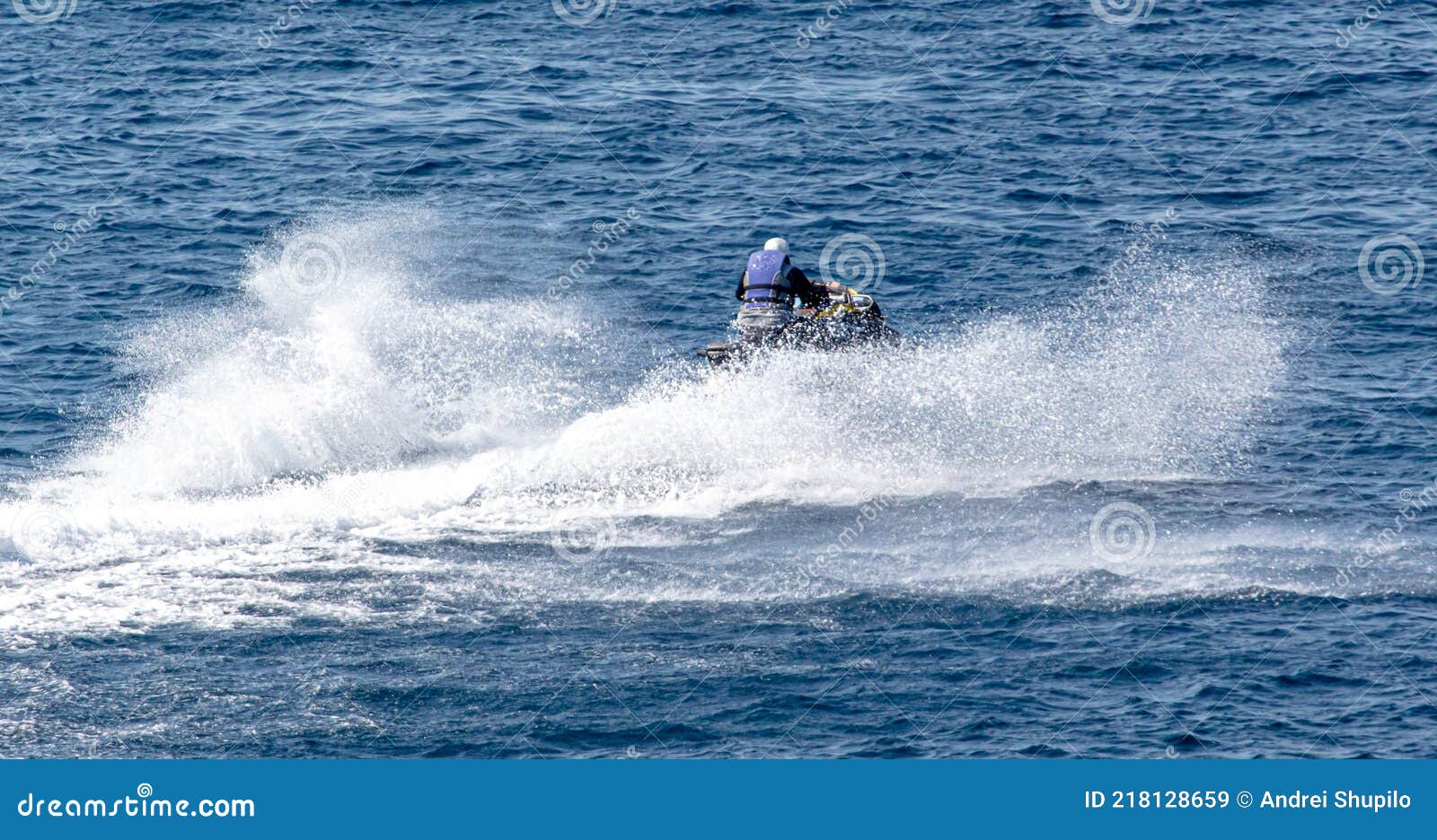 A Motorcycle is Racing in the Blue Water of the Sea Editorial Stock ...