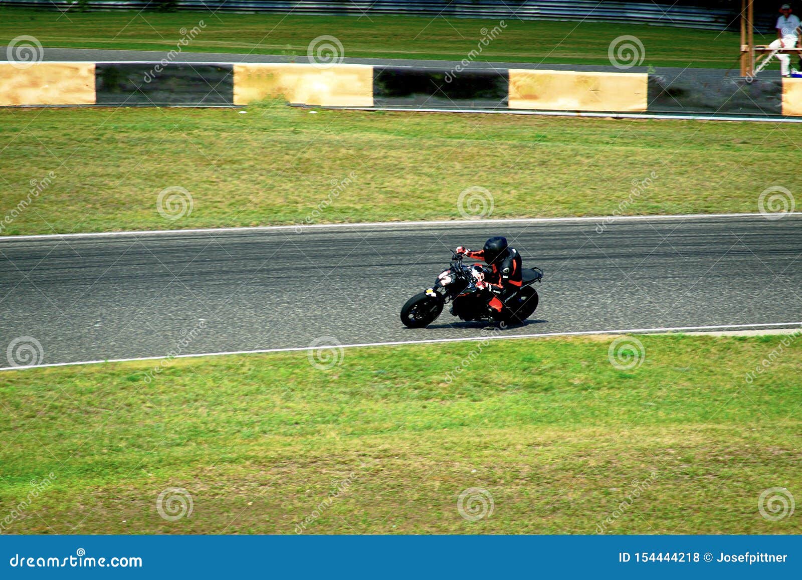 Motorcycle racing on track editorial stock photo. Image of light ...