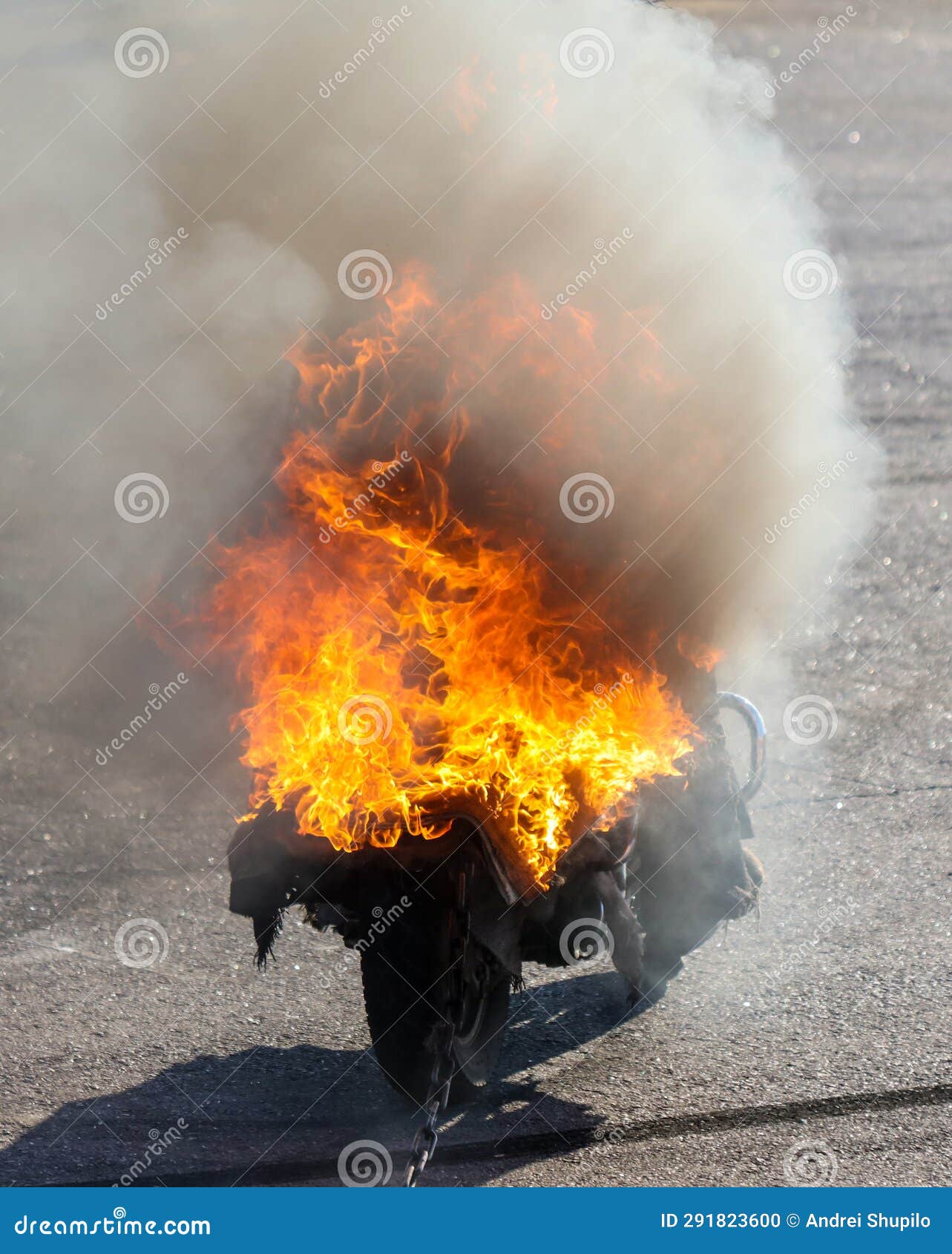 The Motorcycle Rides in Flames of Fire on the Road Stock Photo - Image ...
