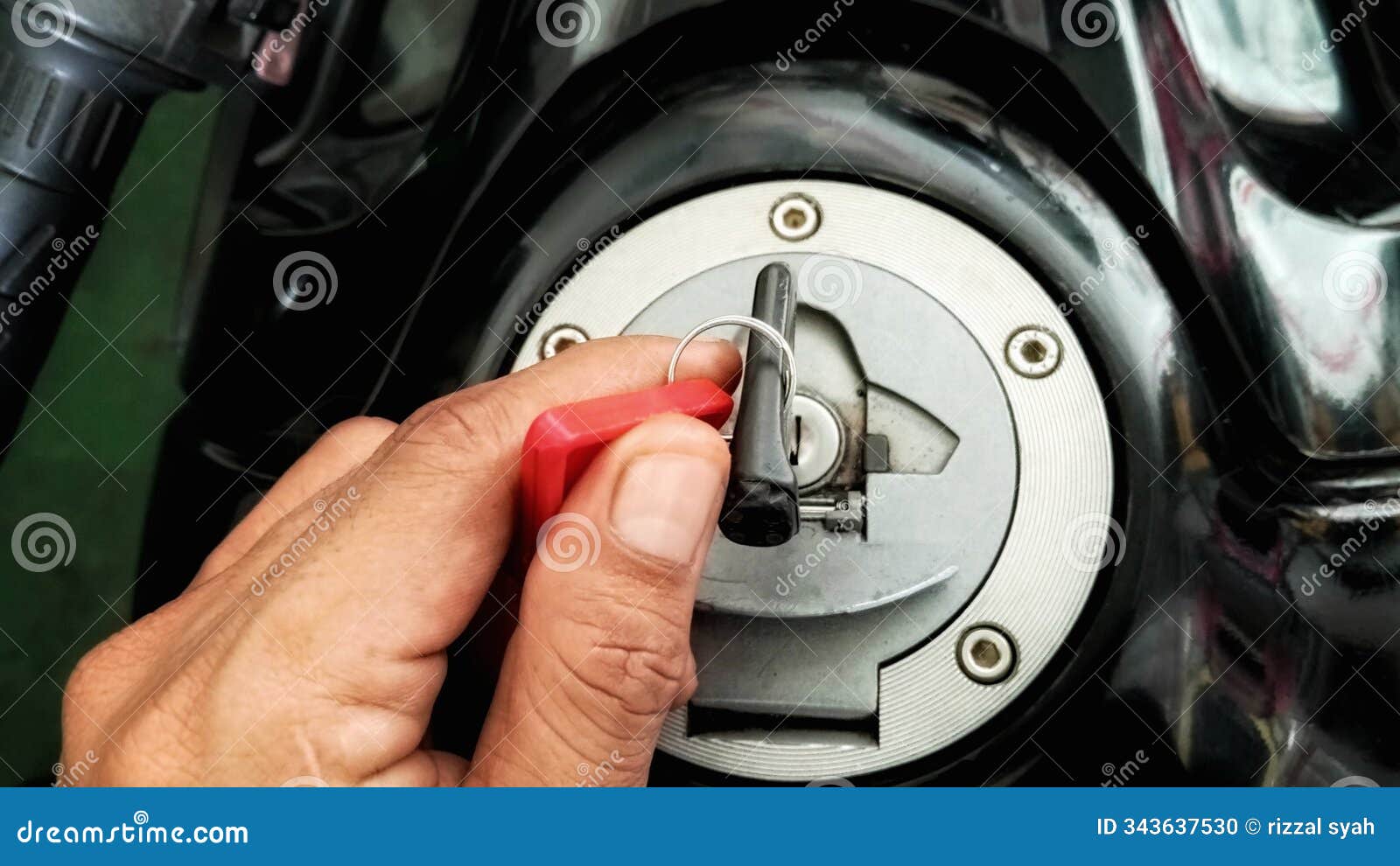 Motorcyclist Inserts Key into Fuel Tank Stock Photo - Image of inserts ...