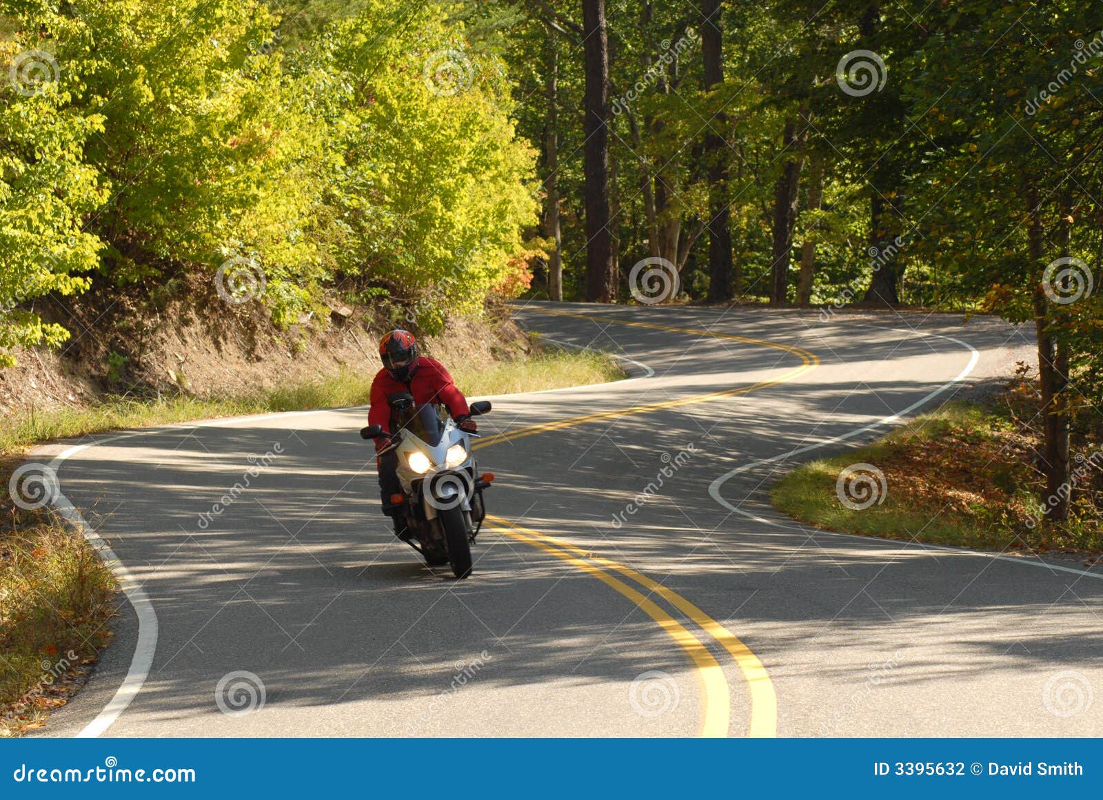 Motorcyclist on a Winding Road Stock Photo - Image of landscape ...