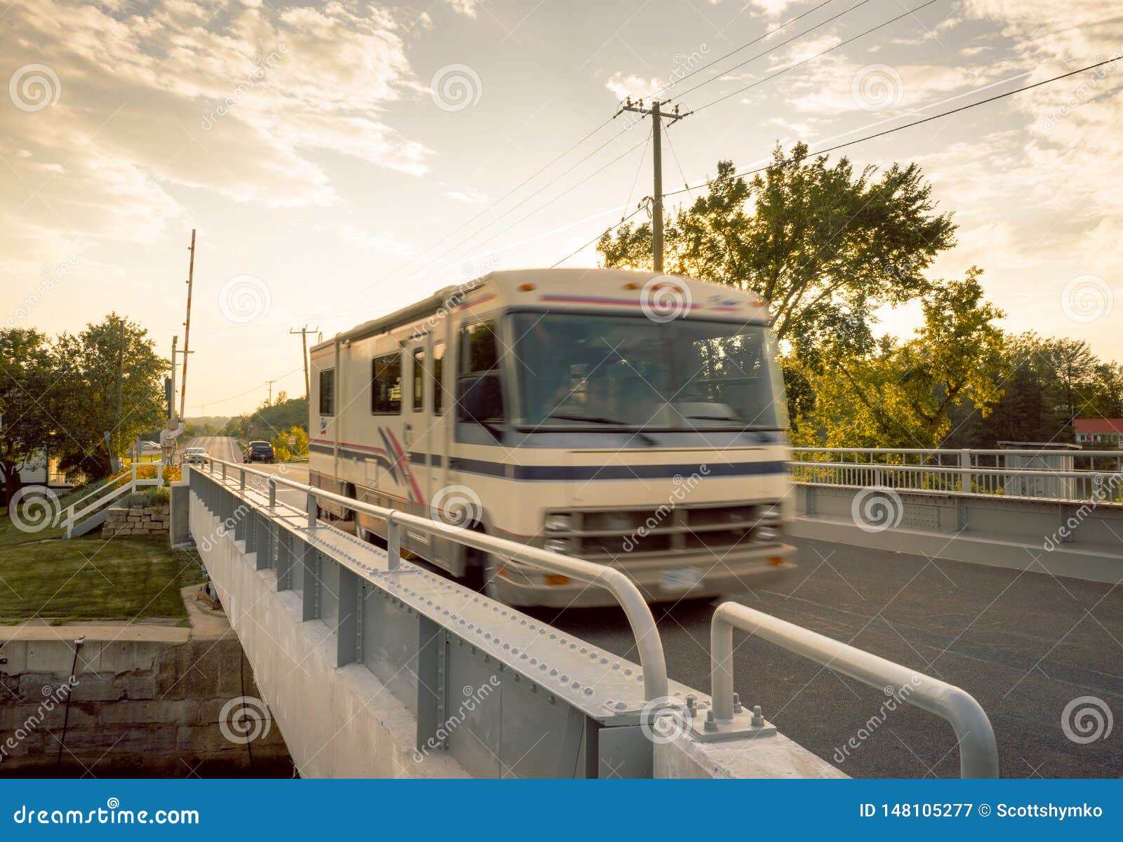 A Motorhome Drives Across a Bridge at Dusk Stock Image - Image of deck ...