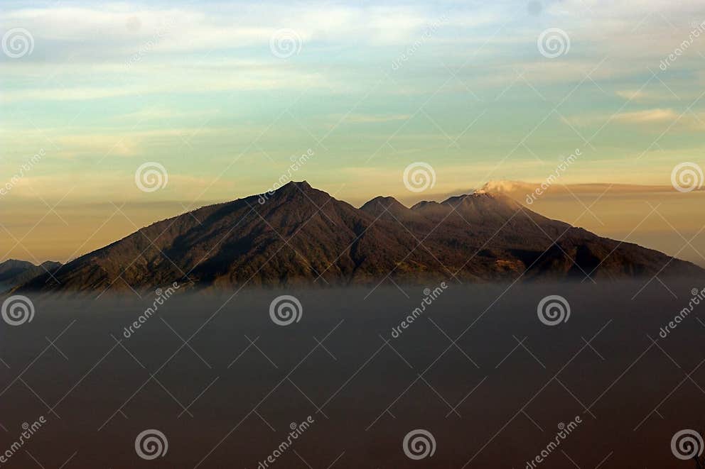 Mount Arjuno-Welirang Covered by Fog Underneath Stock Image - Image of ...
