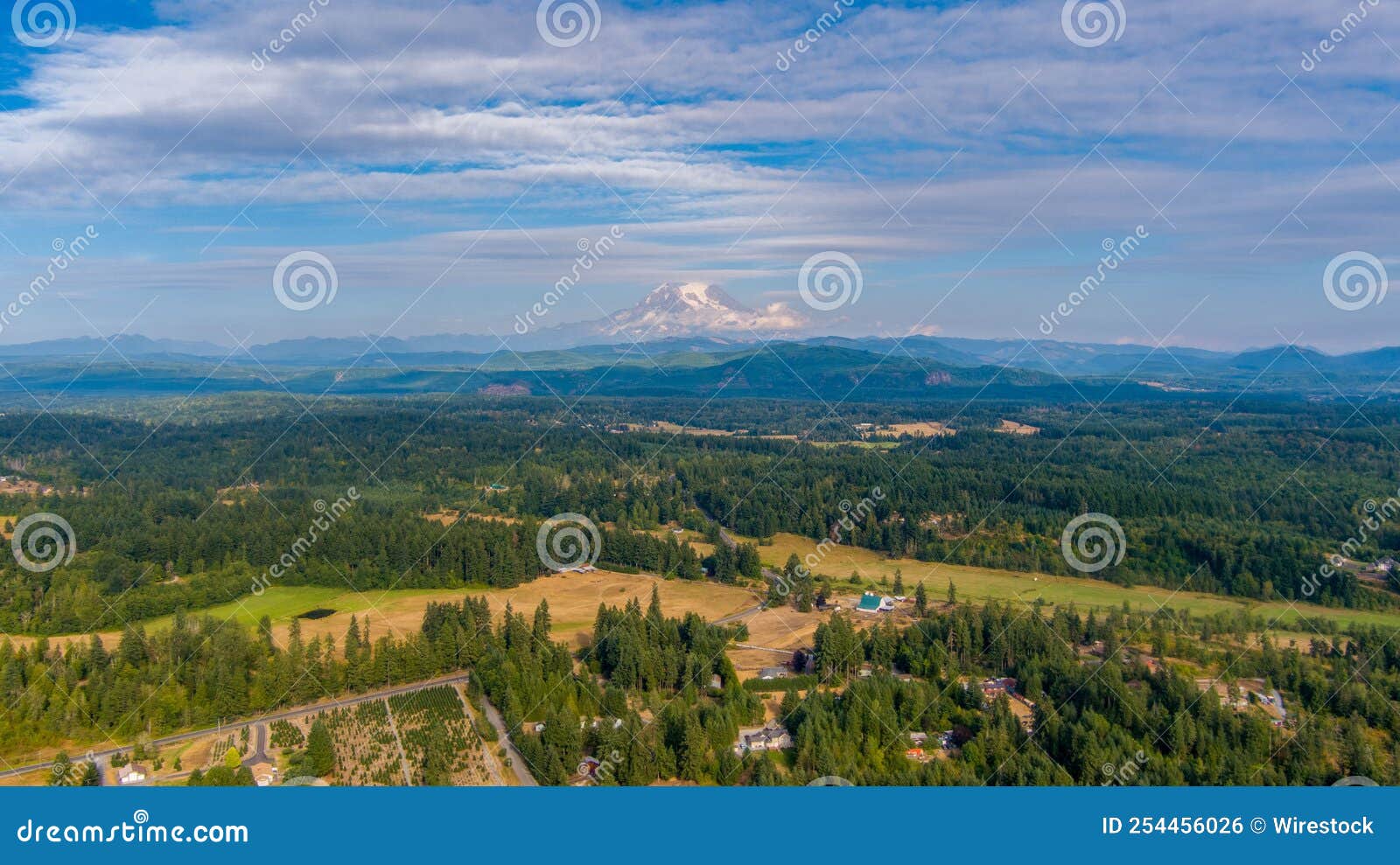 Mount Rainier on the Horizon in August Stock Photo - Image of mountain ...