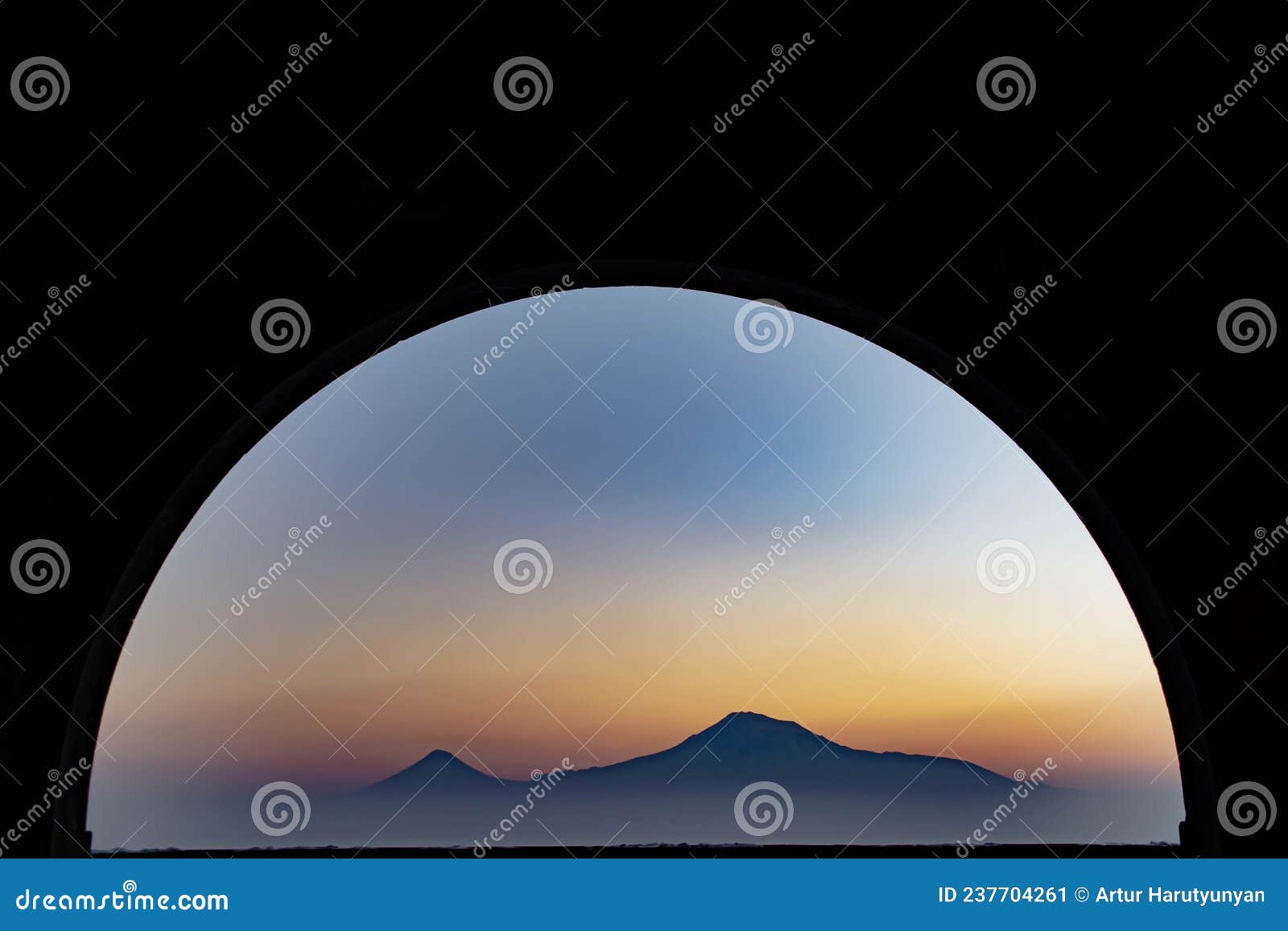 Mountain and Arch. the Mountain and Sunset are Visible through the Arch ...