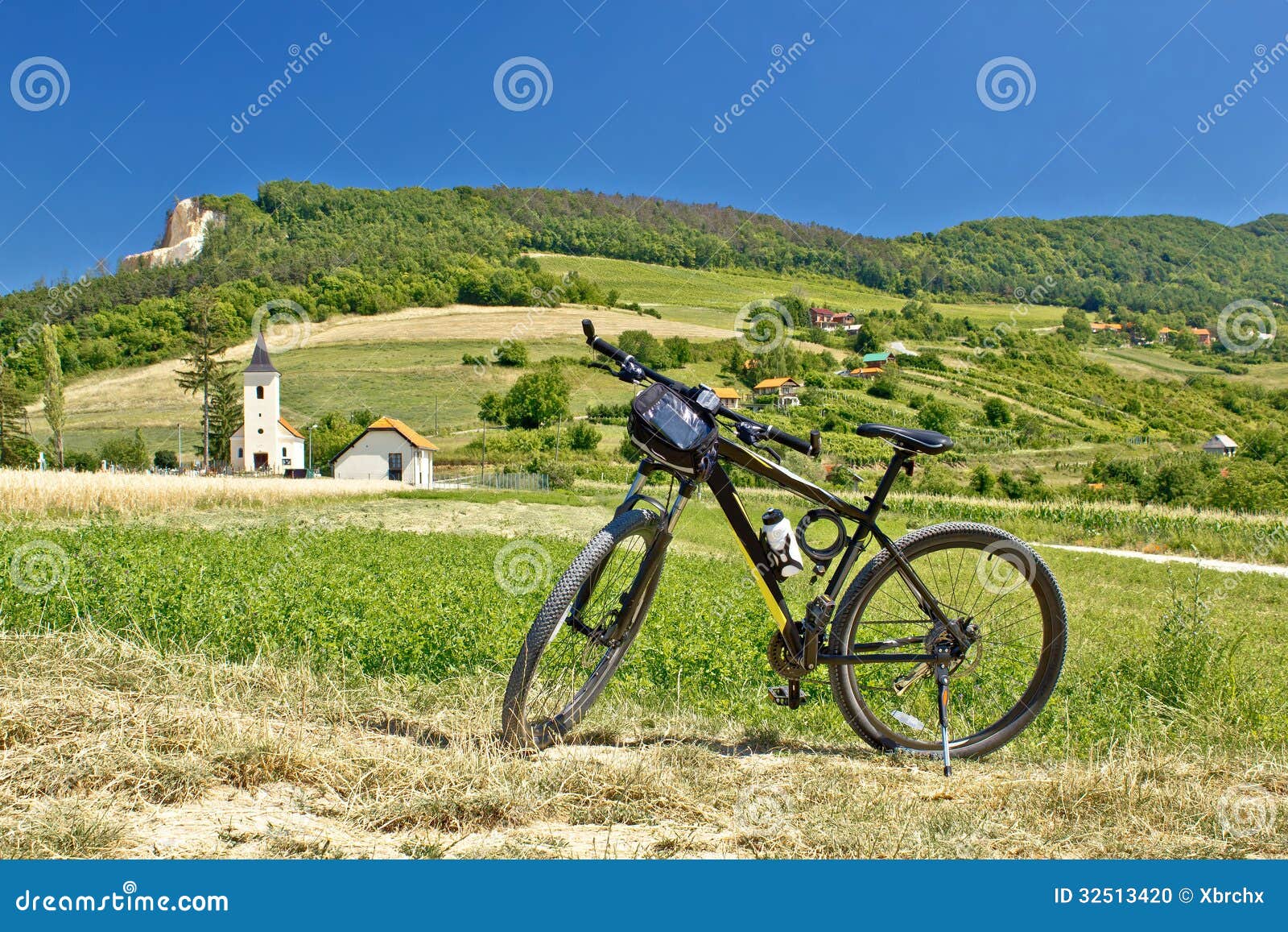 Mountain Bike in Green Landscape Stock Photo - Image of hill, meadow ...