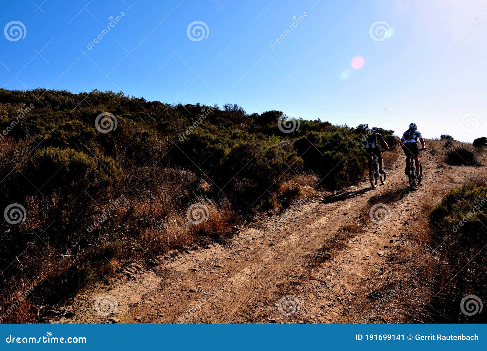 Two Mountain Bkiers Going Uphill Stock Image - Image of landscape ...