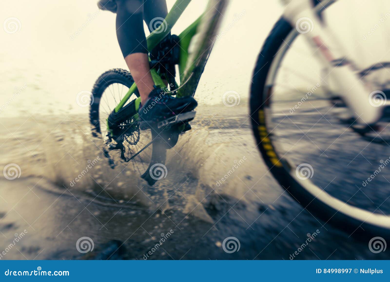 Mountain Biker Racing through Puddle Stock Image - Image of sports ...