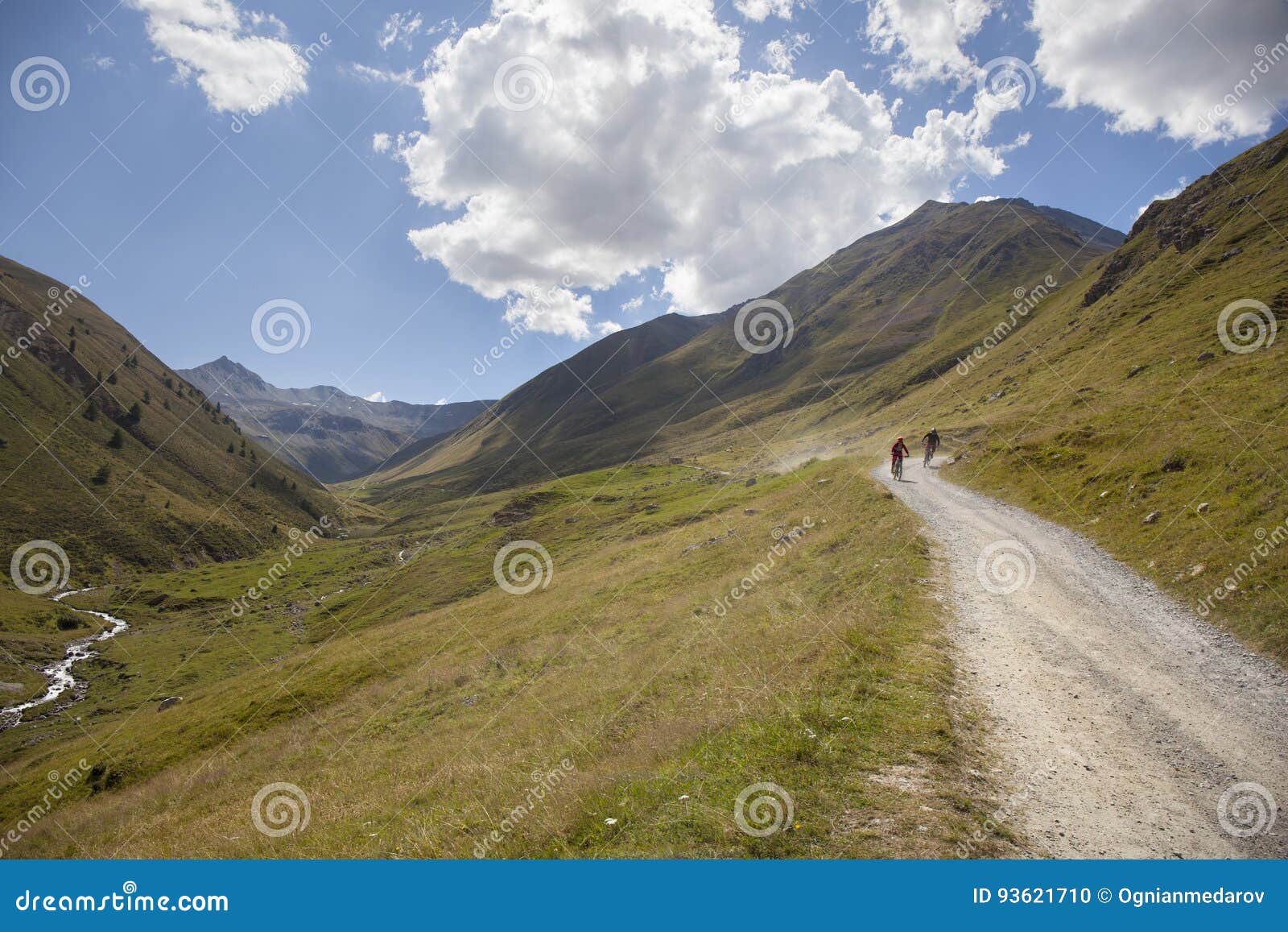 Mountain Bikers Going Down a Steep Road Stock Photo - Image of cycling ...