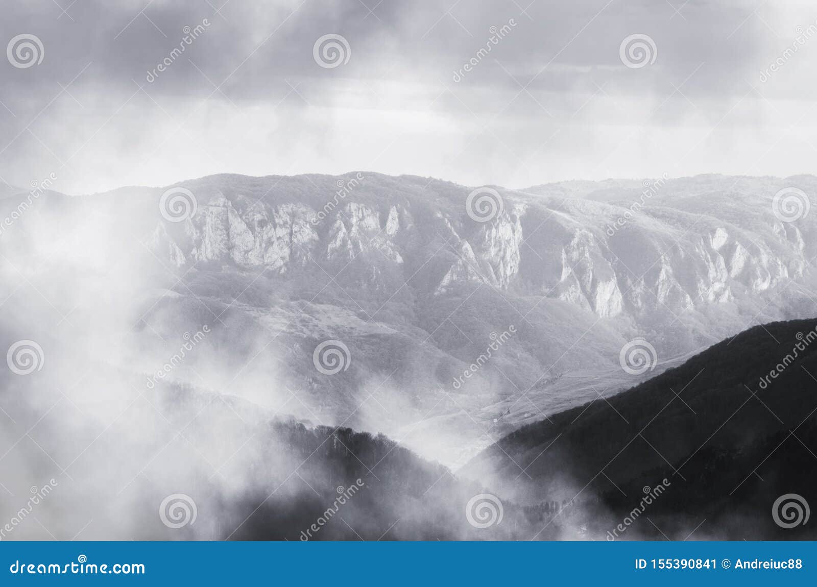 Mountain cliff in the mist stock image. Image of cliff - 155390841