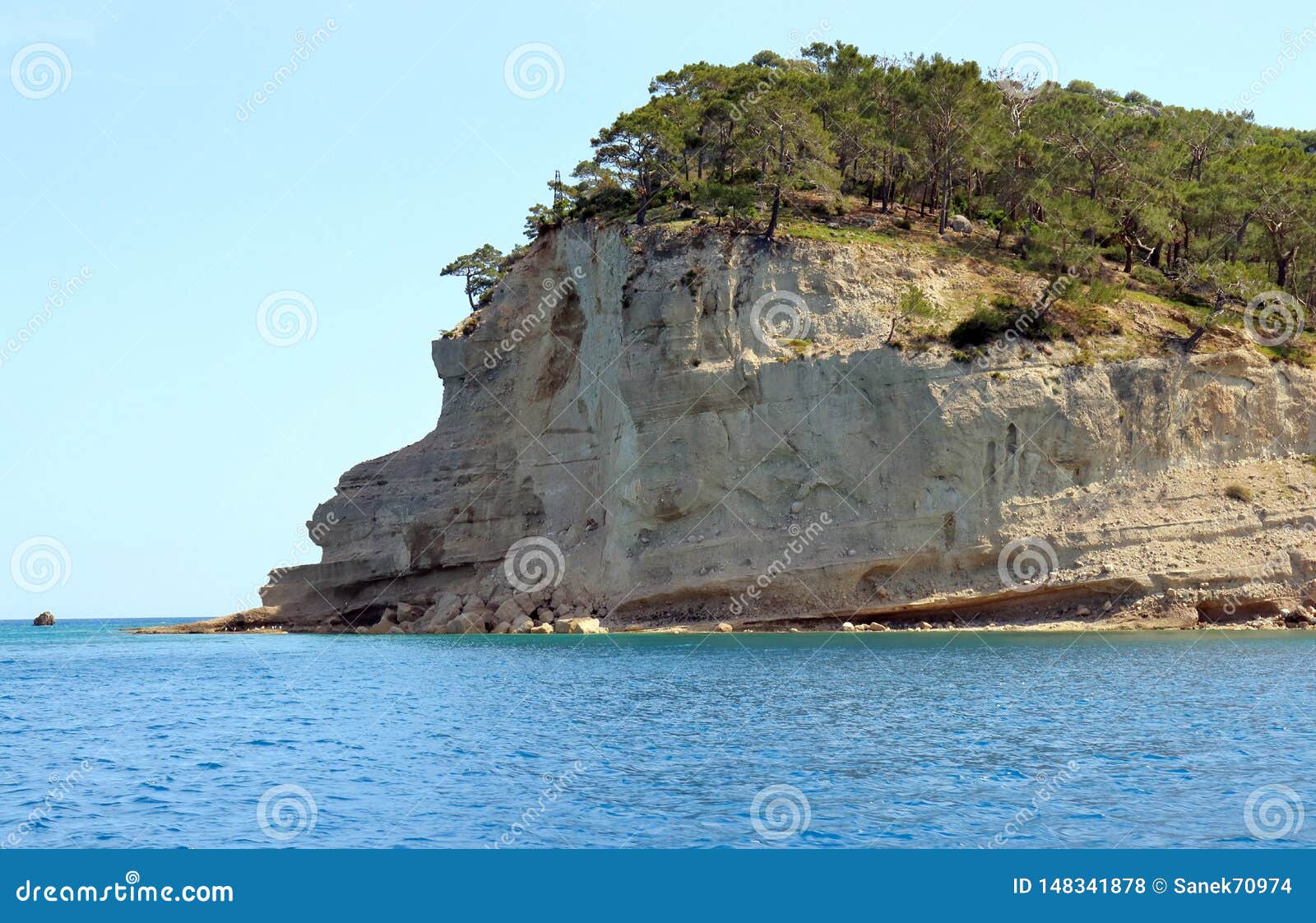 Mountain cliff by the sea stock photo. Image of blue - 148341878