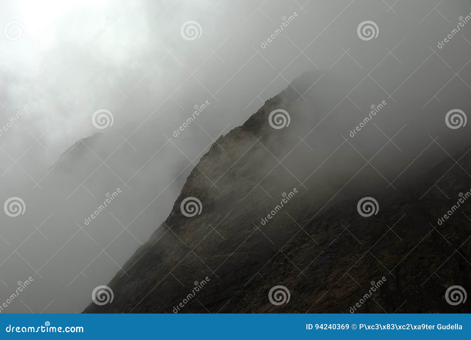Mountain cliffs in fog stock image. Image of cold, background - 94240369