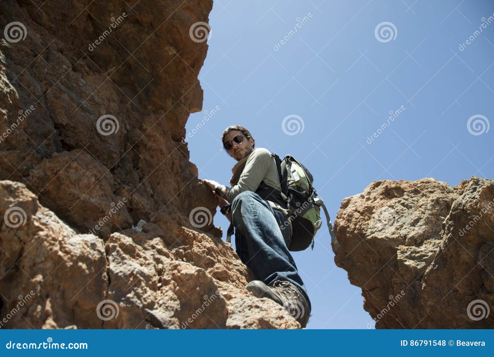 Mountain Climber with Backpack Climbing Rocks Stock Photo - Image of ...