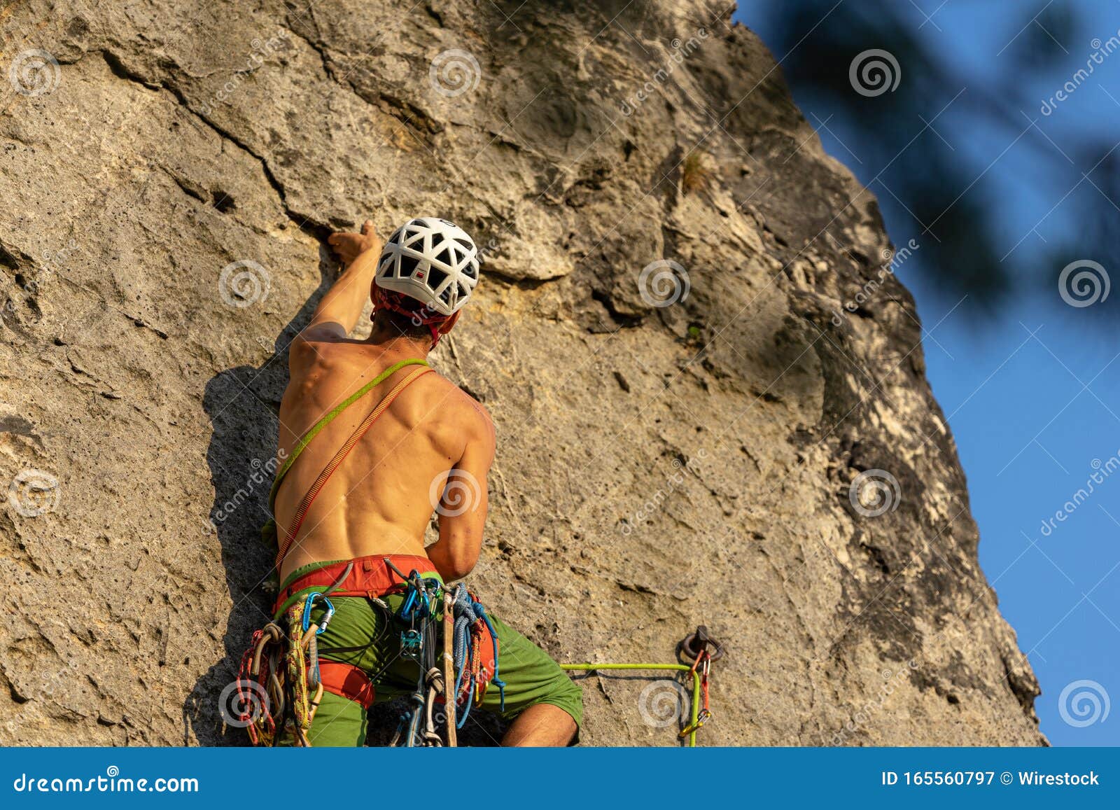Mountain Climber Climbing the Cliff Using His Climbing Equipment ...