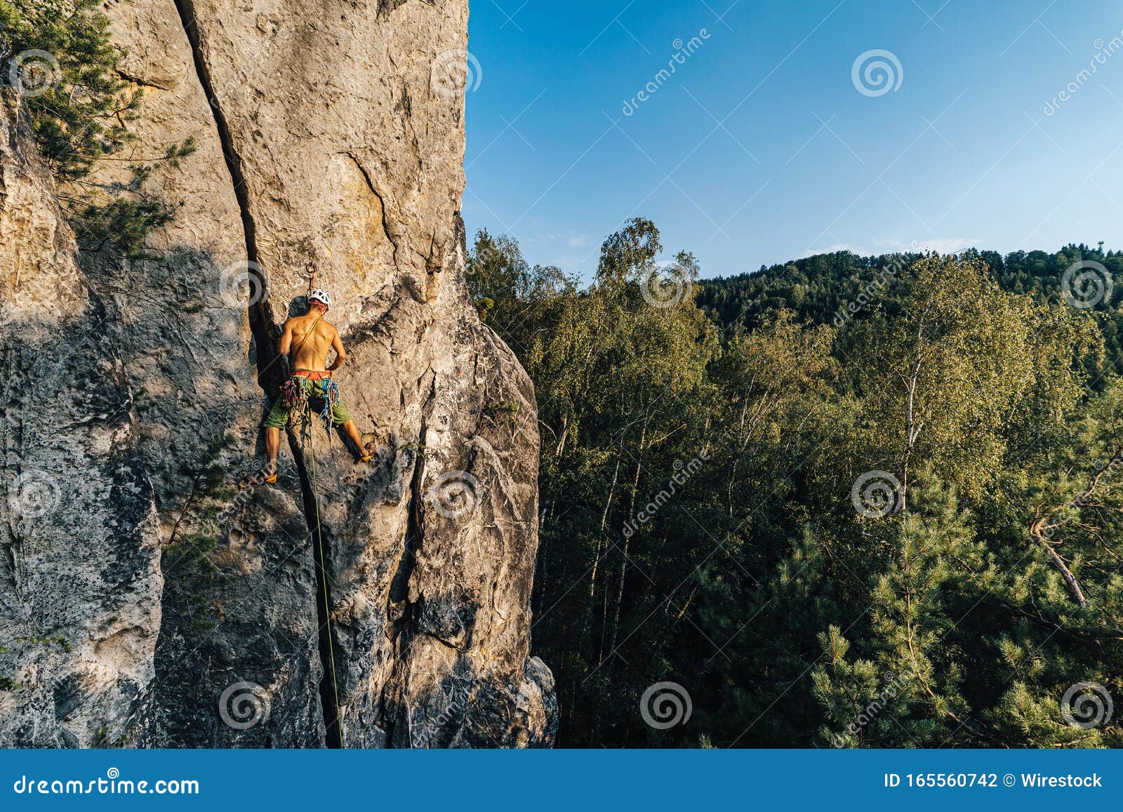 Mountain Climber Climbing the Cliff Using His Climbing Equipment ...