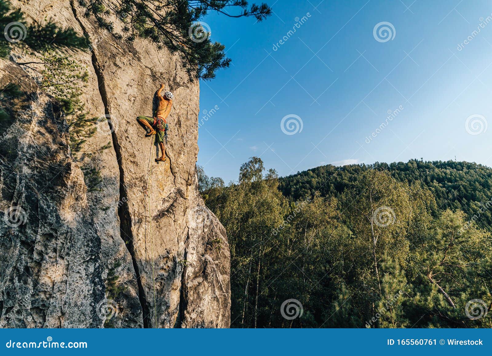 Mountain Climber Climbing the Cliff Using His Climbing Equipment ...