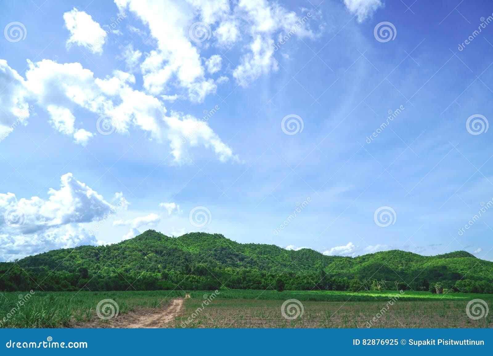 Mountain and Field with Blue Sky Stock Image - Image of grass, mountain ...