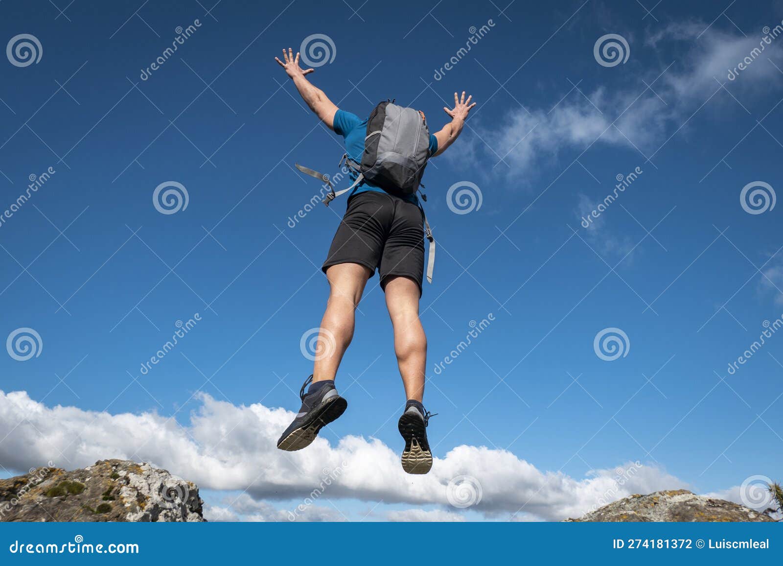 Mountain Jump with Open Arms Stock Photo - Image of clothing, strong ...