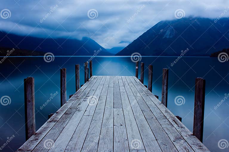 Mountain lake with a jetty stock photo. Image of landscape - 19672392