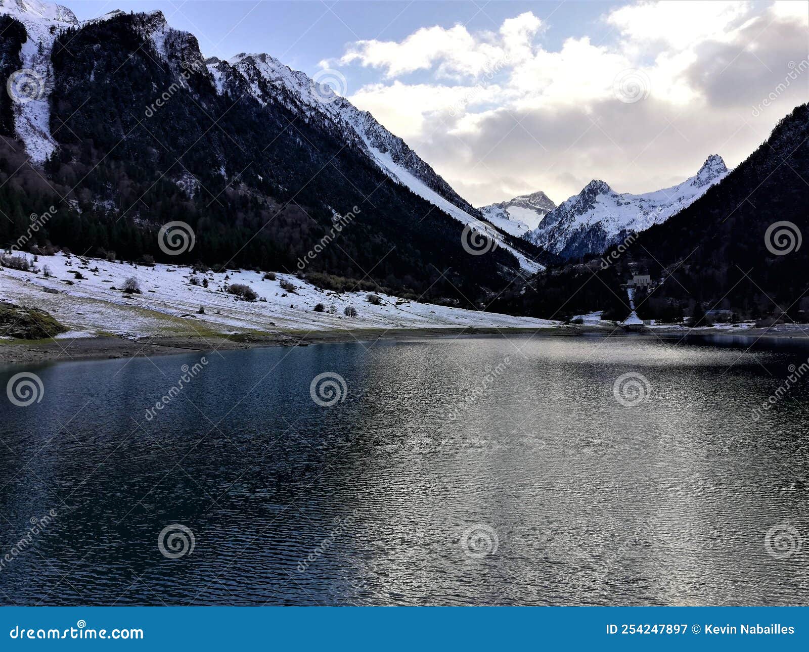 Mountain lake under snow stock image. Image of lake - 254247897
