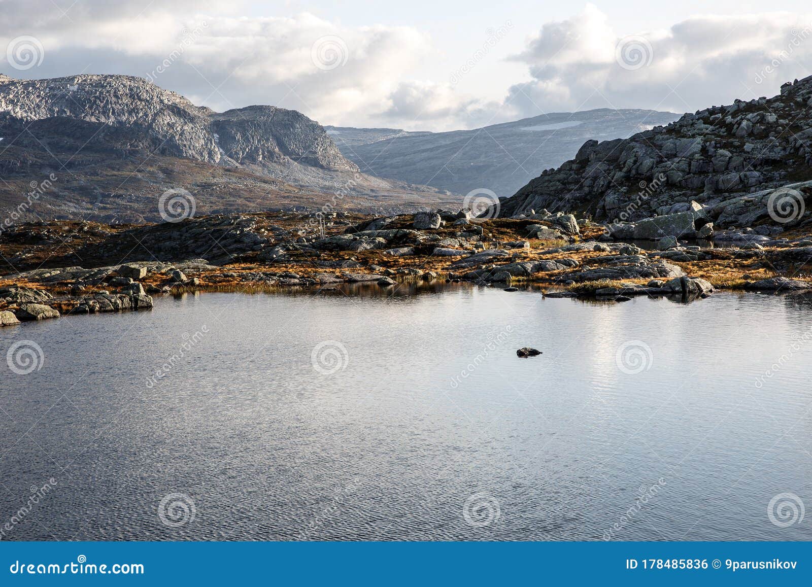 Mountain Lake. Water Surface Surrounded by Rocks Stock Photo - Image of ...