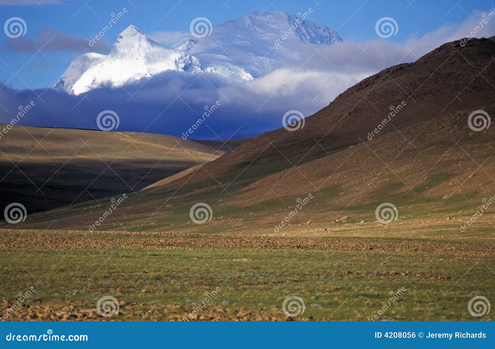 Mountain Looming Over Tibetan Plateau Stock Photo - Image of mount ...