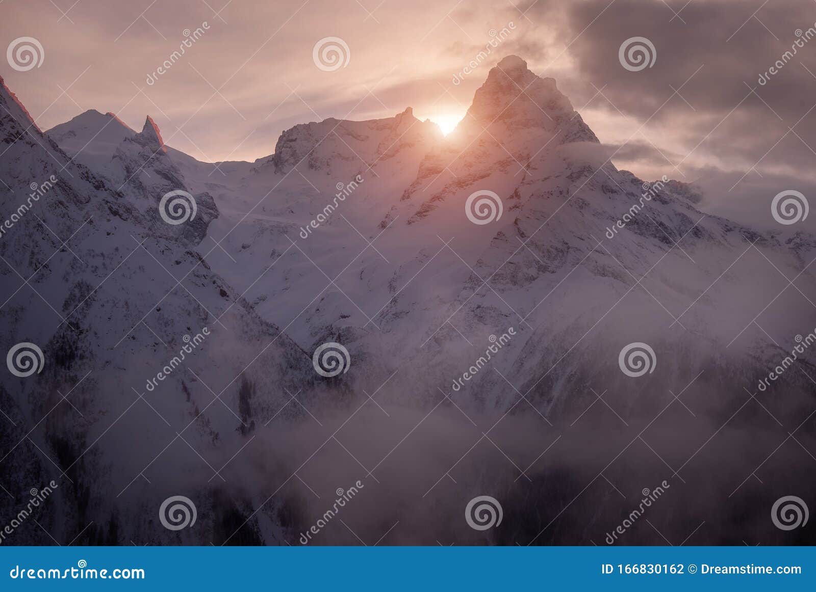 Mountain Peaks Backlit by the Sun Stock Photo - Image of blue ...
