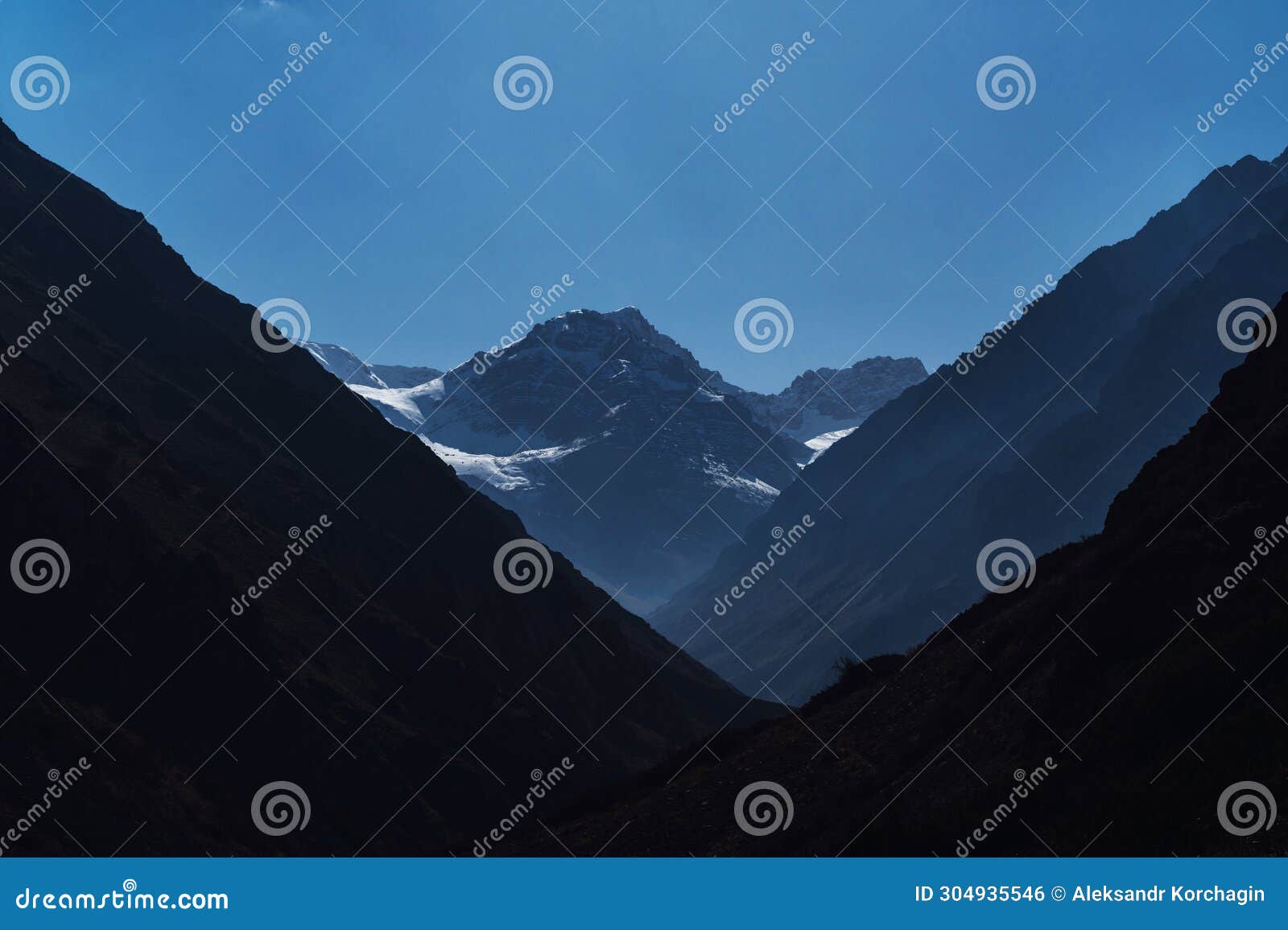 Mountain Peaks of Glaciers with Snow on Background of a Blue Stock ...