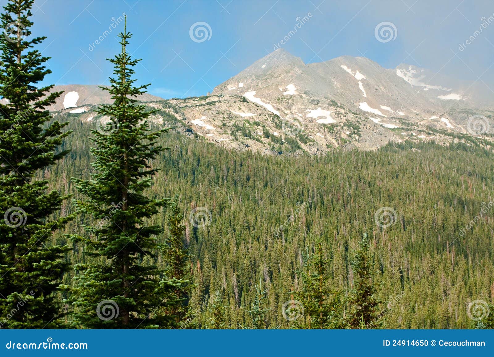 Mountain Peaks through Wispy Clouds Stock Photo - Image of back, rocks ...