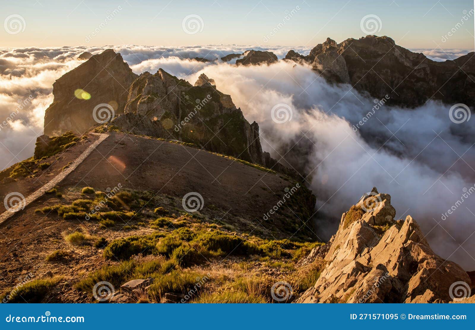 Mountain Pinnacles at Sunset. Clouds Below the Peaks. Stock Image ...