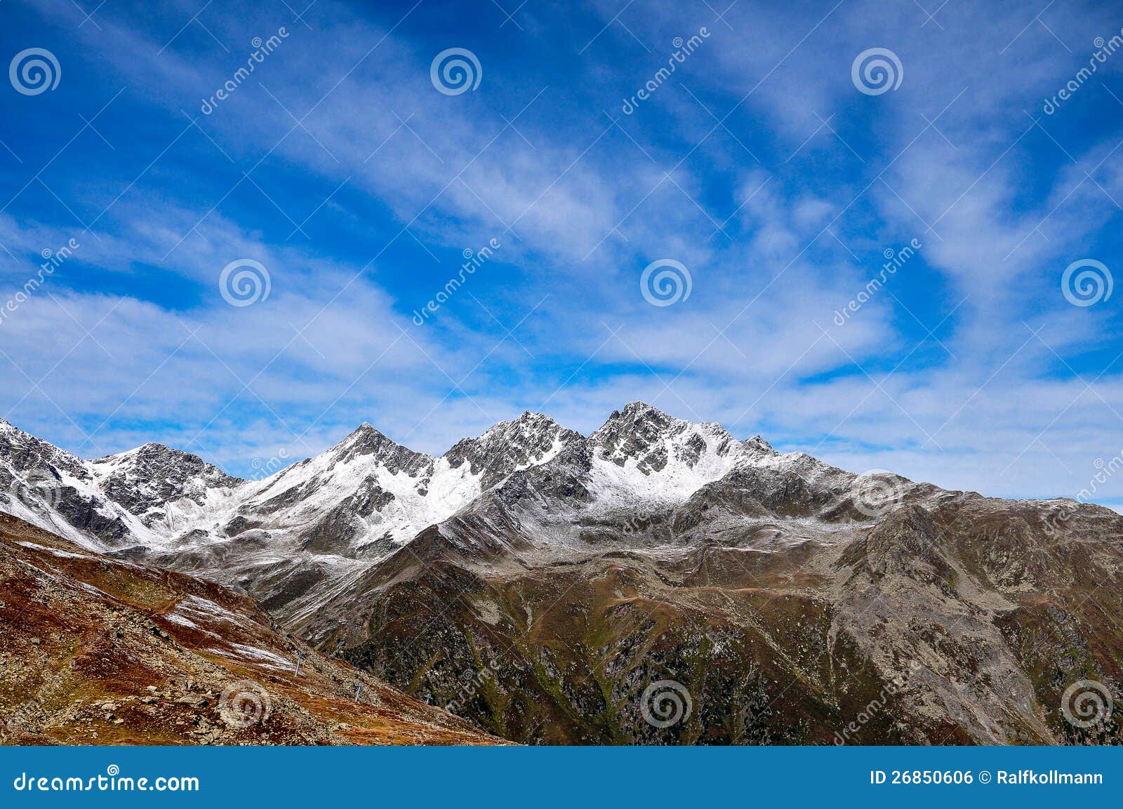 A Mountain Range in the Alps Stock Photo - Image of austria, clouds ...