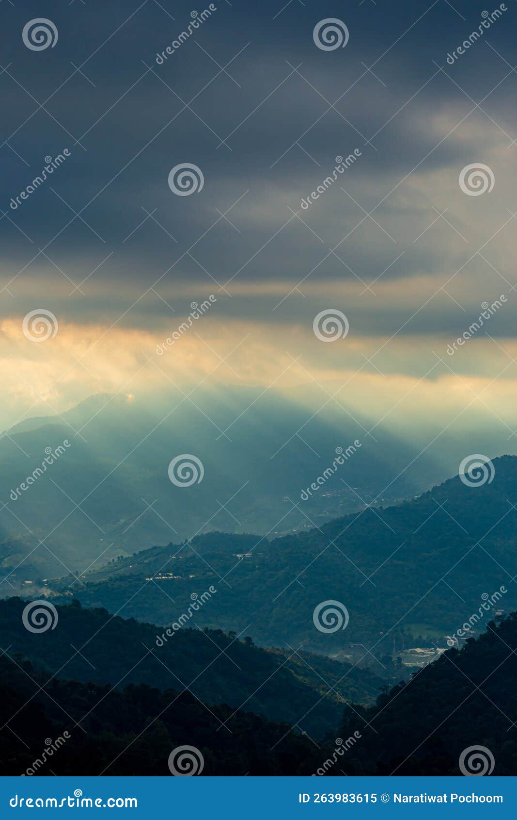 Mountain Range in the Morning with Clouds and Light Shining Down Stock ...
