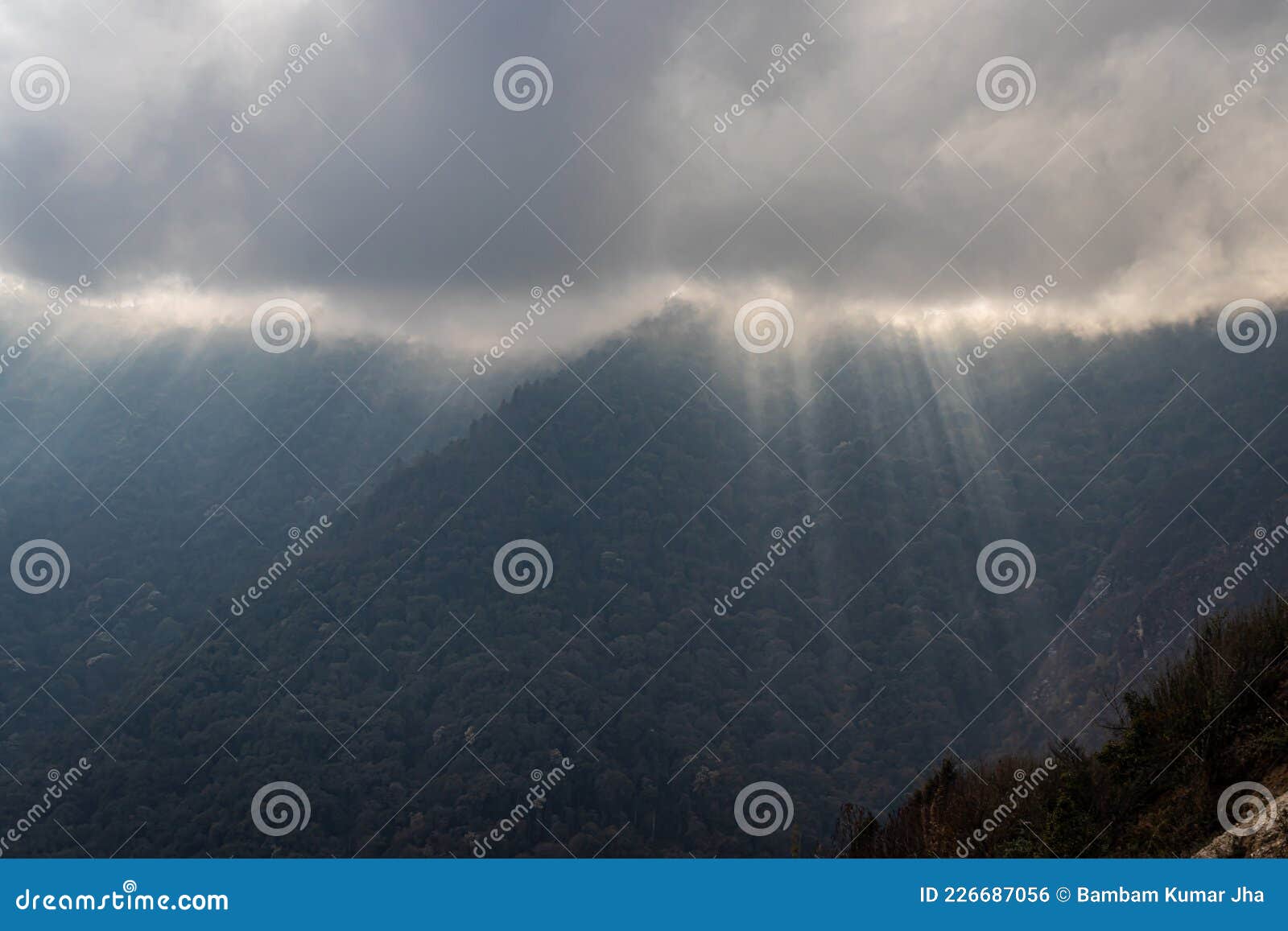 Mountain Range with Sun Ray Beams and Heavy Cloud Overcast at Day Stock ...