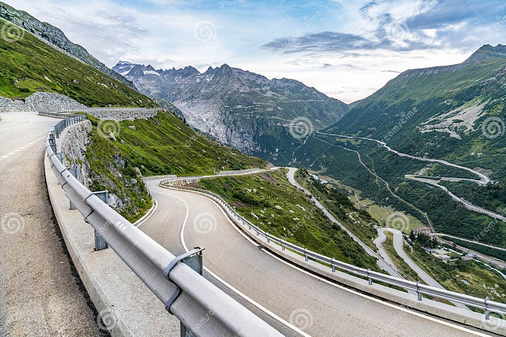 A Mountain Range in Swiss Alps with a Road in Front of it in Swiss ...