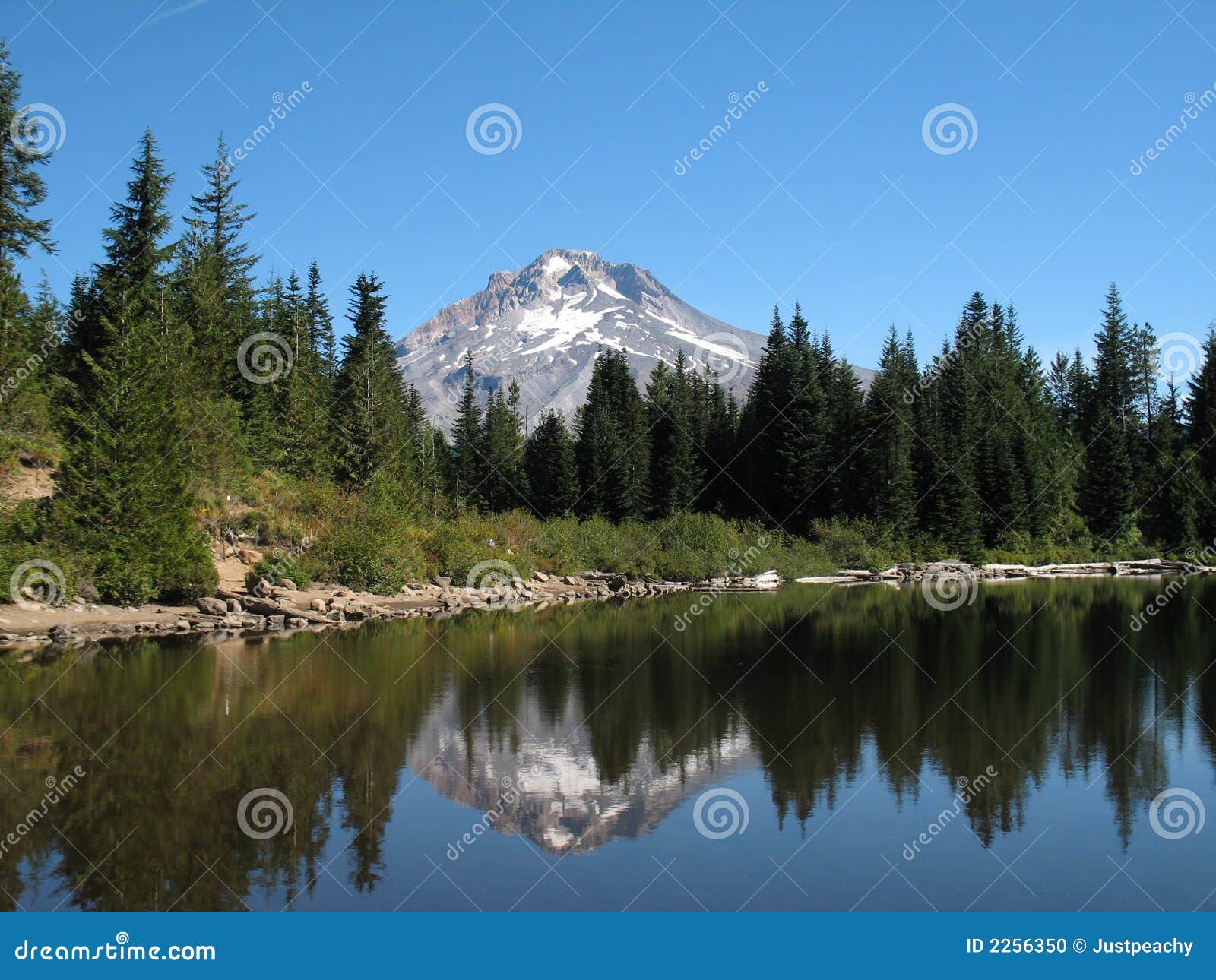 Mountain reflected in lake stock photo. Image of shoreline - 2256350