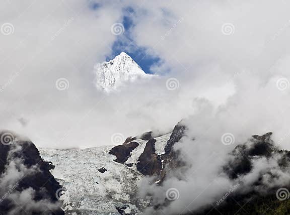 Mountain Shrouded Behind Clouds Stock Image - Image of tibetan, mystery ...