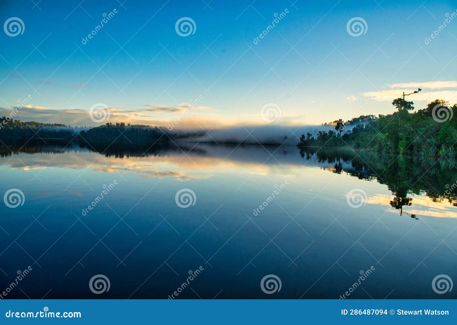 Mountain and Sky Reflections on the Calm Surface of the West Coasts ...