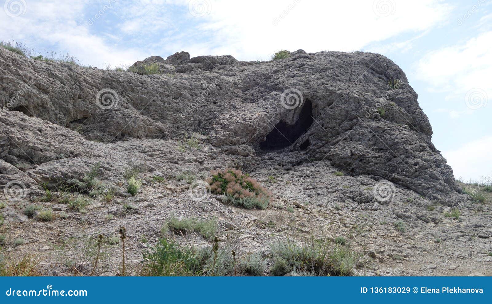 Mountain with a small cave stock image. Image of cave - 136183029
