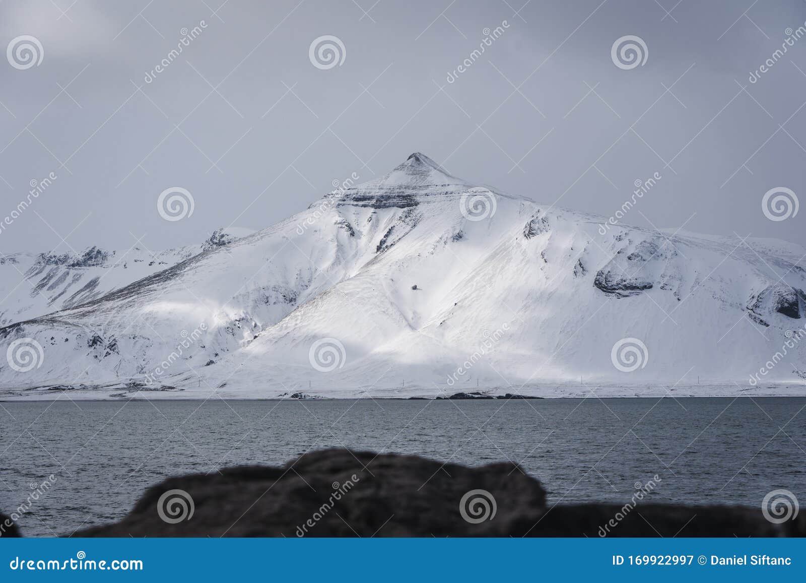 Mountain with Soft Light Shining through the Clouds Stock Image - Image ...