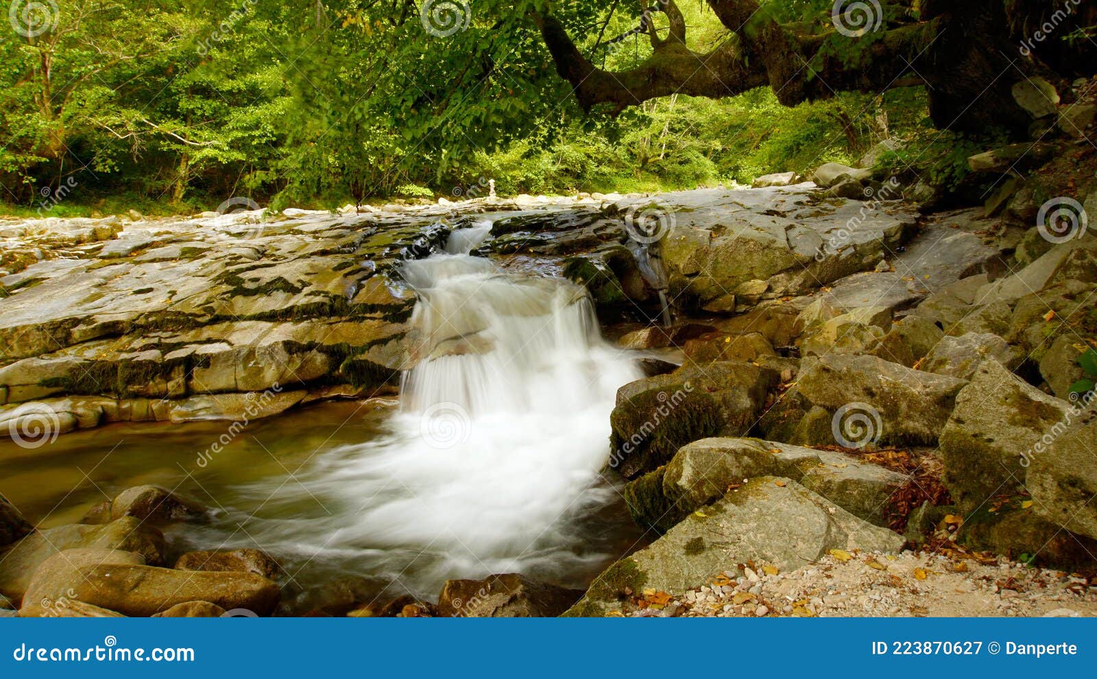 Mountain River with a Tiny Waterfall among the Rocks Stock Image ...