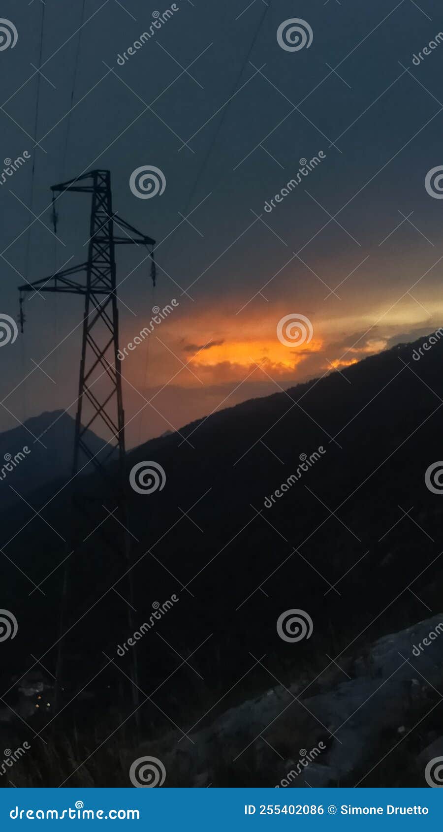 Mountain Sunset with a High Voltage Pylon in the Background Stock Photo ...
