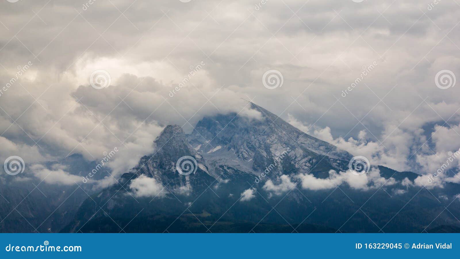 Mountain top with clouds stock image. Image of majestic - 163229045