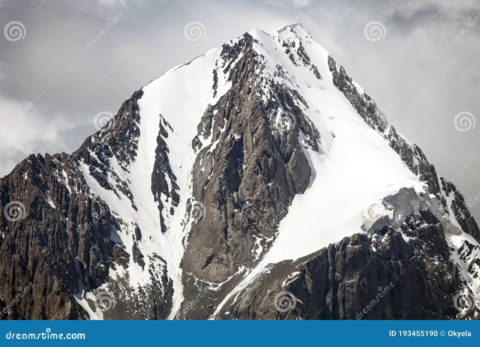 Mountain Top with Steep Cliffs Covered with Snow and Ice Stock Photo ...